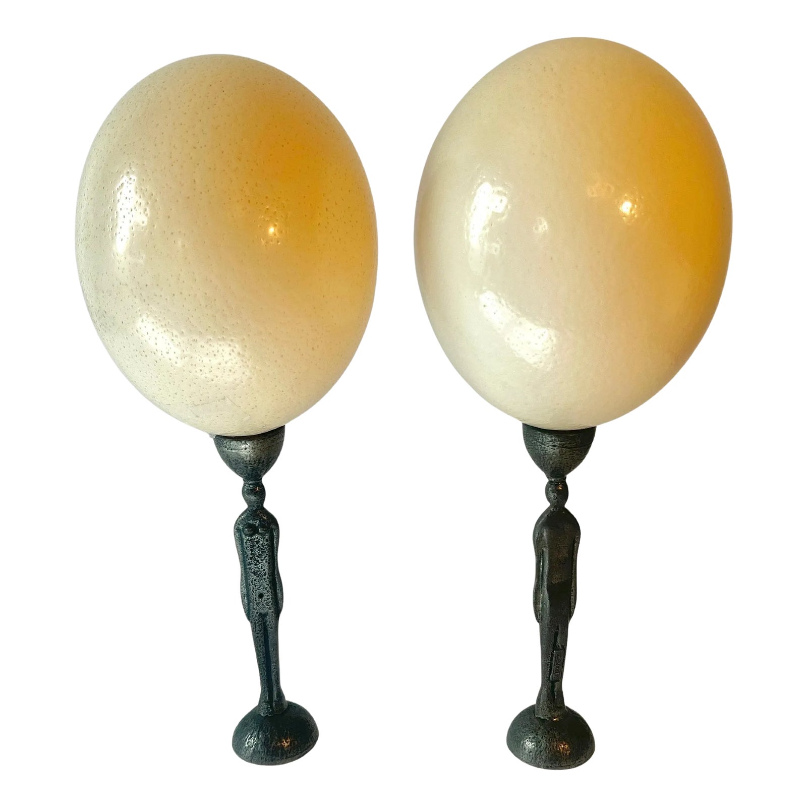 Pair of Ostrich Eggs on Male and Female Modernist Metal Figures | Chairish