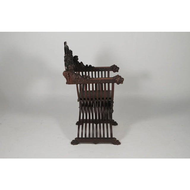 1890s Vintage Heavily Carved Figural Campaign Chair | Chairish