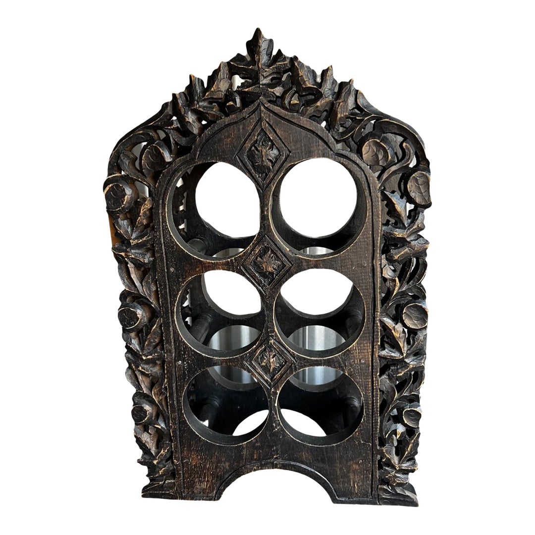 Early 20th Century Black Gothic Carved Wine Rack | Chairish