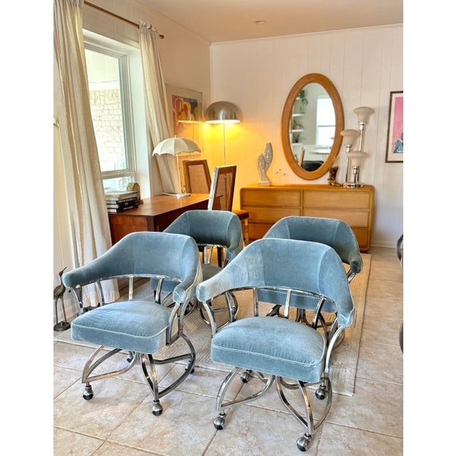 A Mid Century Modern Chrome Dining Set Including 4 Chairs on Casters and a Table Circa 1980s