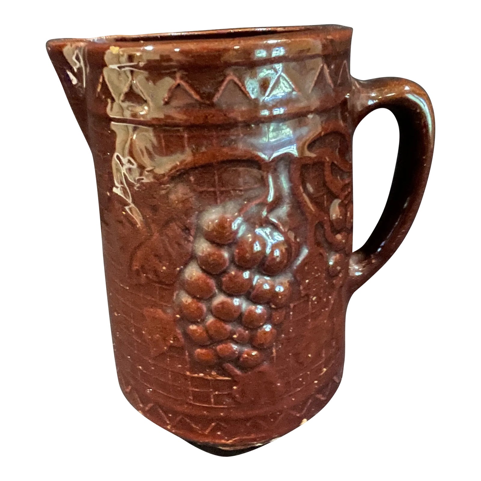 brown ceramic pitcher