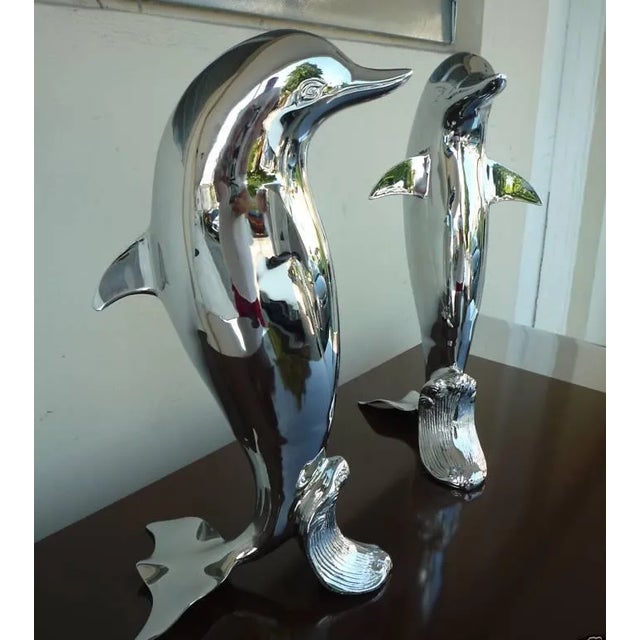 Pair of 70's Chromed Upright Swimming Dolphins | Chairish