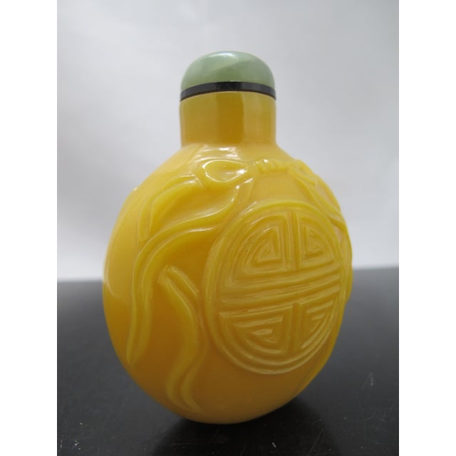 Chinese Imperial Yellow Peking Glass Snuff Bottle With Carved Longevity ...