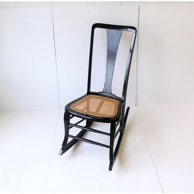Vintage Mid Century Black Lacquer and Cane Rocking Chair | Chairish