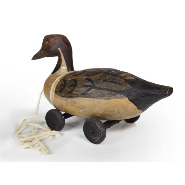 Vintage Wood Carved Painted Duck on Wheels Pull Toy | Chairish