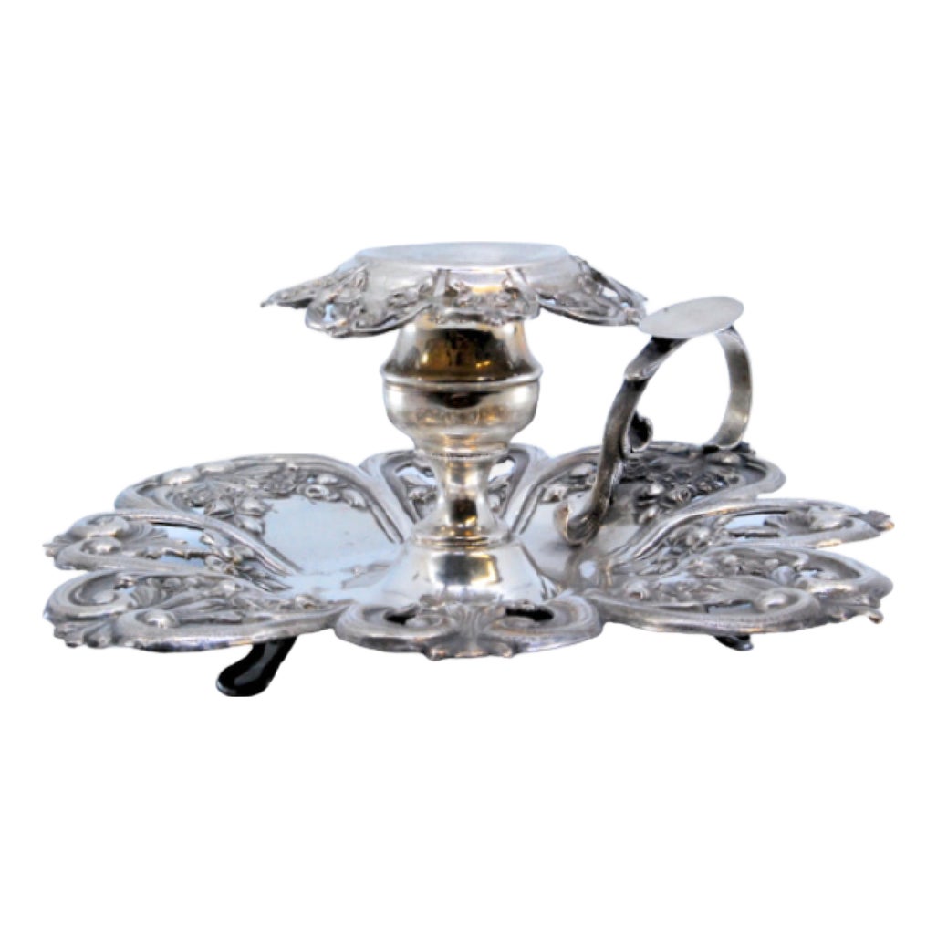Silver Paddle with Raised Floral Motifs and Resting on Three Feet ...