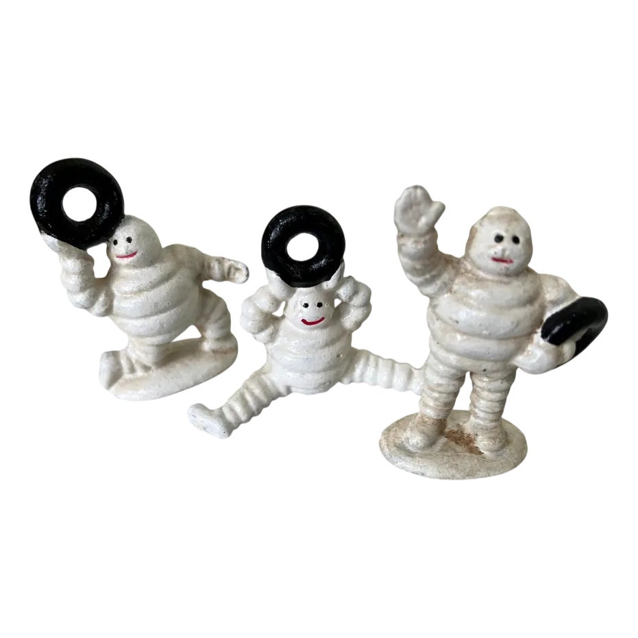 Vintage Cast Iron Michelin Man Models, Set of 3 | Chairish