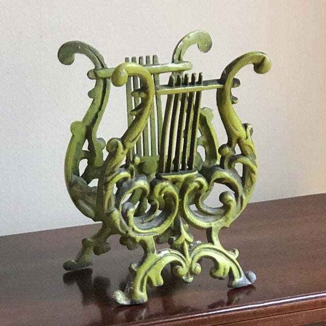Mid-20th Century Cast Iron Lyre Magazine / Display Stand | Chairish