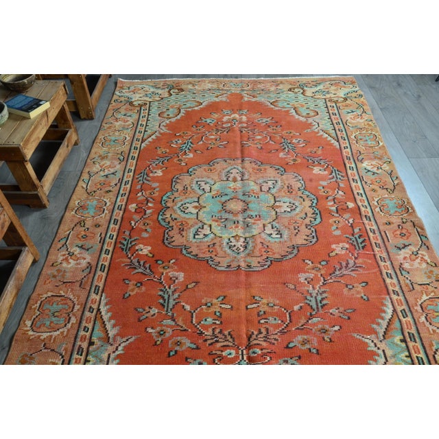 dark orange patterned rug