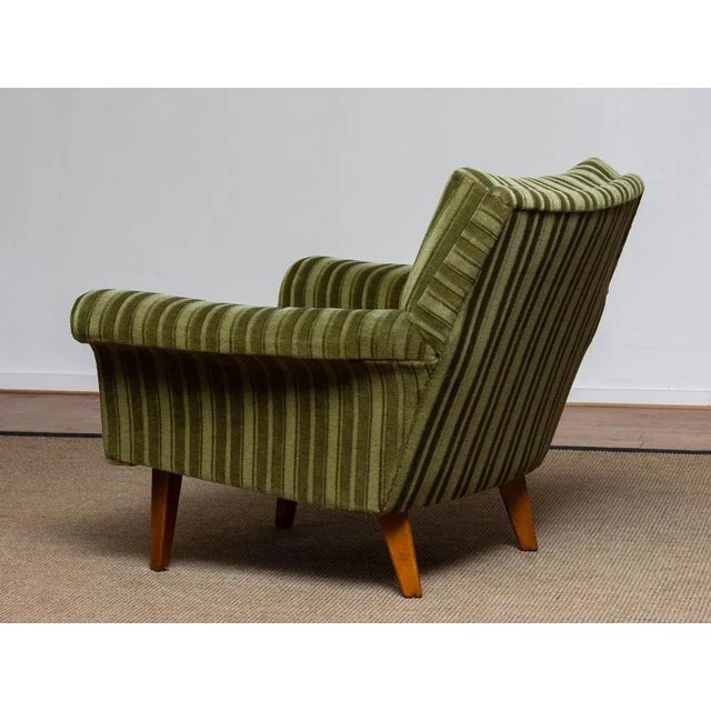 Green striped armchair store