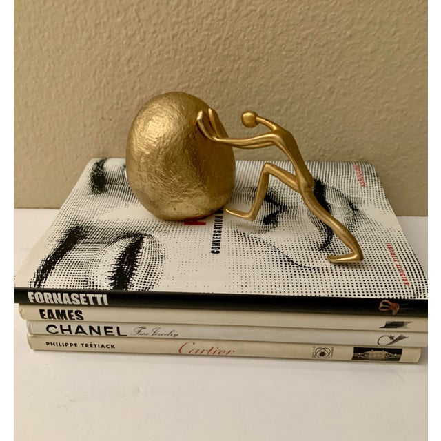 Mid 20th Century Modernist Man Pushing Boulder Bookend | Chairish
