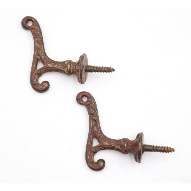 Pair of Antique Art Nouveau Cast Iron Wall Hooks | Chairish