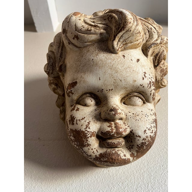 cherub statue face