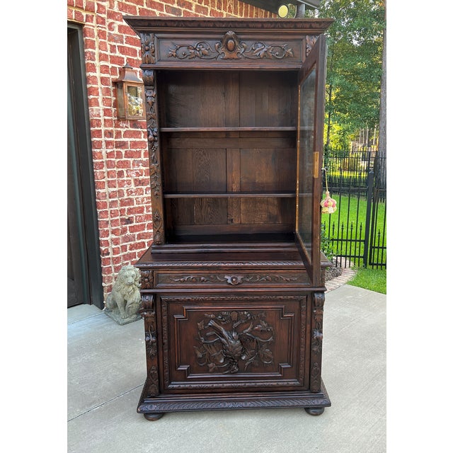 19th Century Antique French Hunt Black Forest Oak Bookcase | Chairish